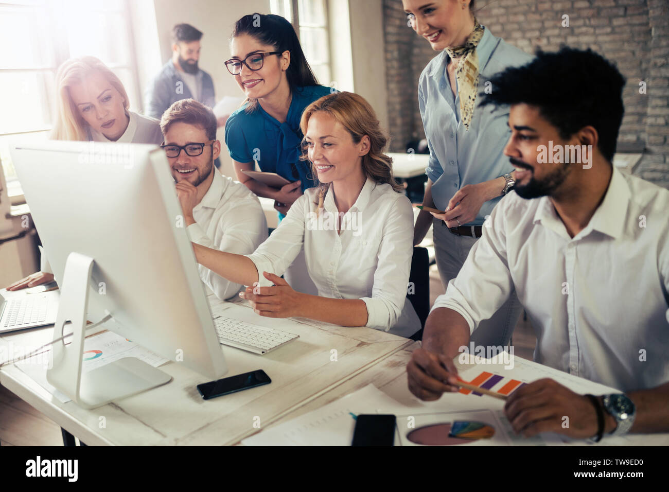 Happy creative team in office. Business, startup, design, people and ...