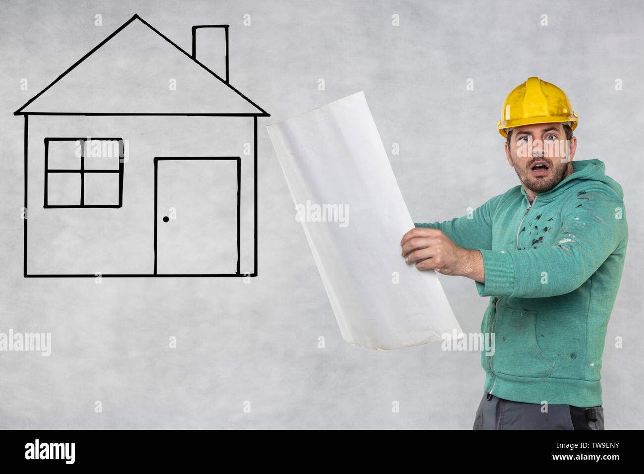 A construction engineer is looking at house plans Stock Photo - Alamy