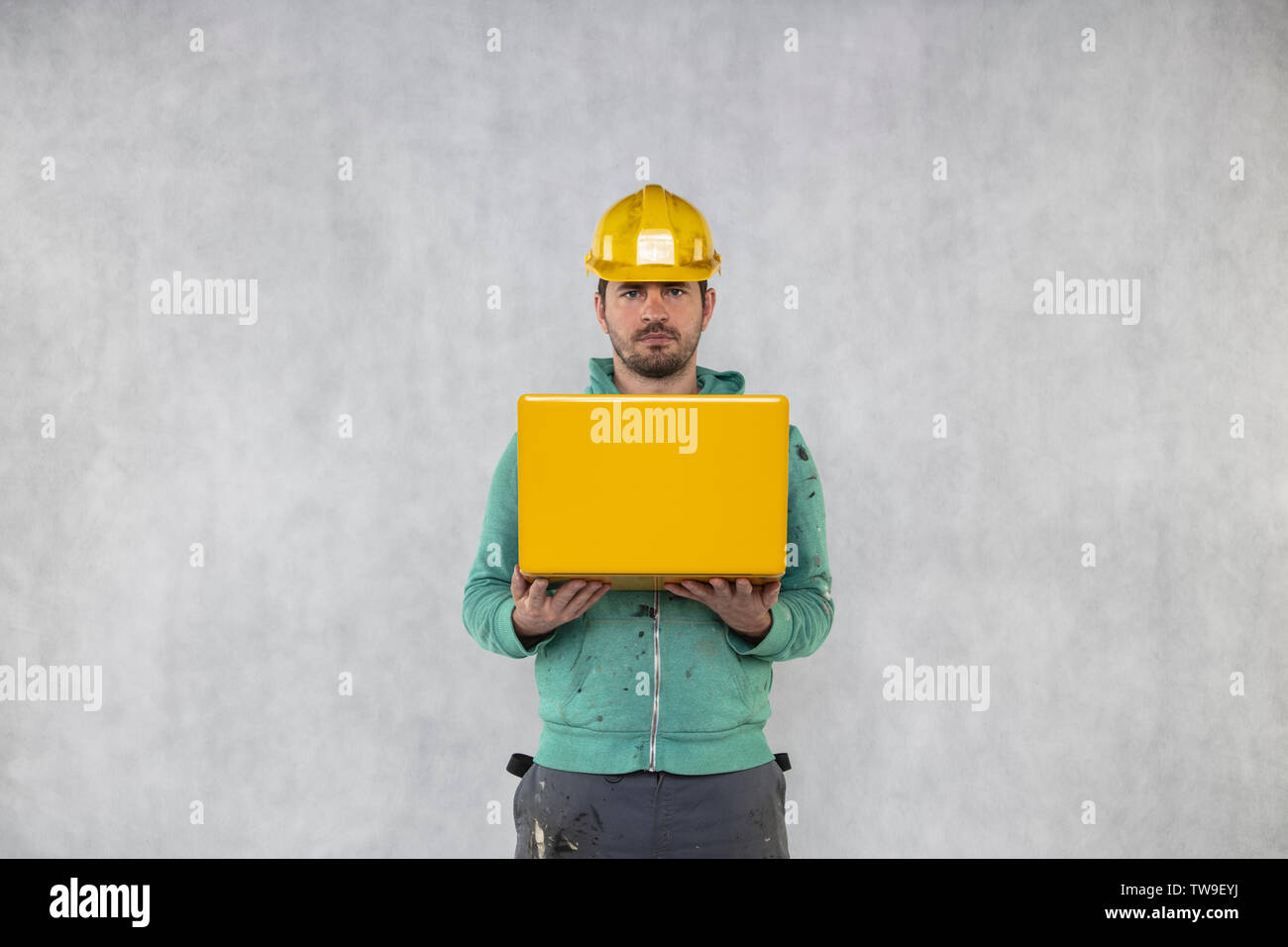 builder with a computer in his hands Stock Photo - Alamy