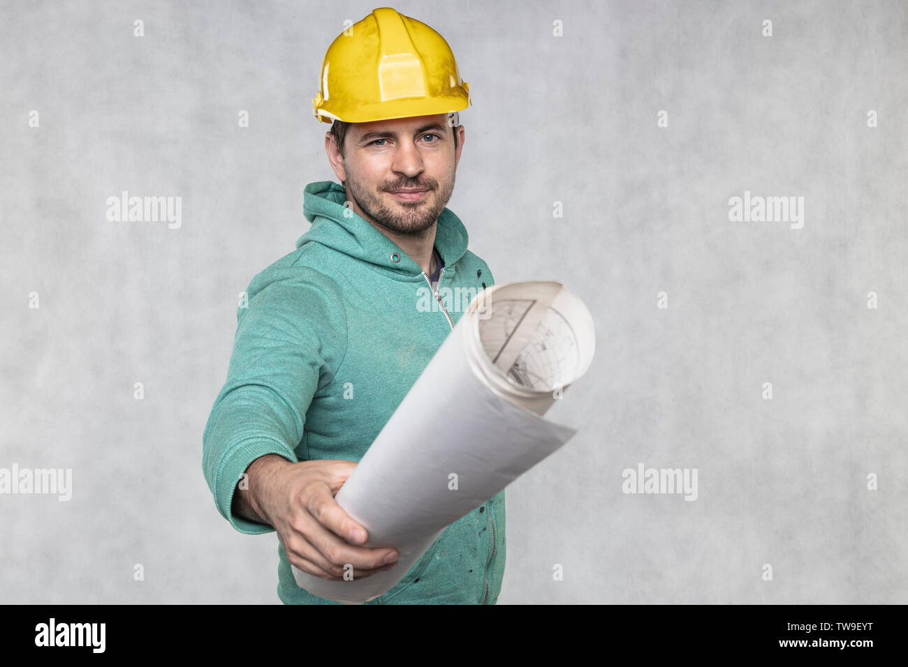 The construction engineer gives construction plans for you Stock Photo ...