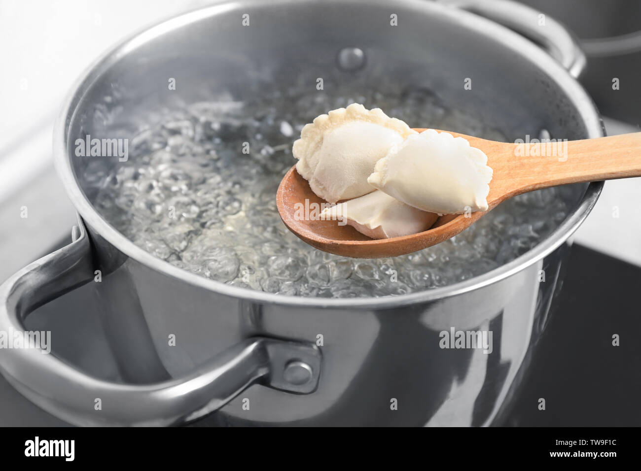 Cooking dumplings in boiling water, closeup Stock Photo - Alamy