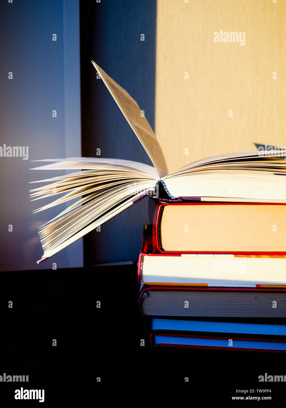 a stack of books and one is open, concept learning, school, University ...