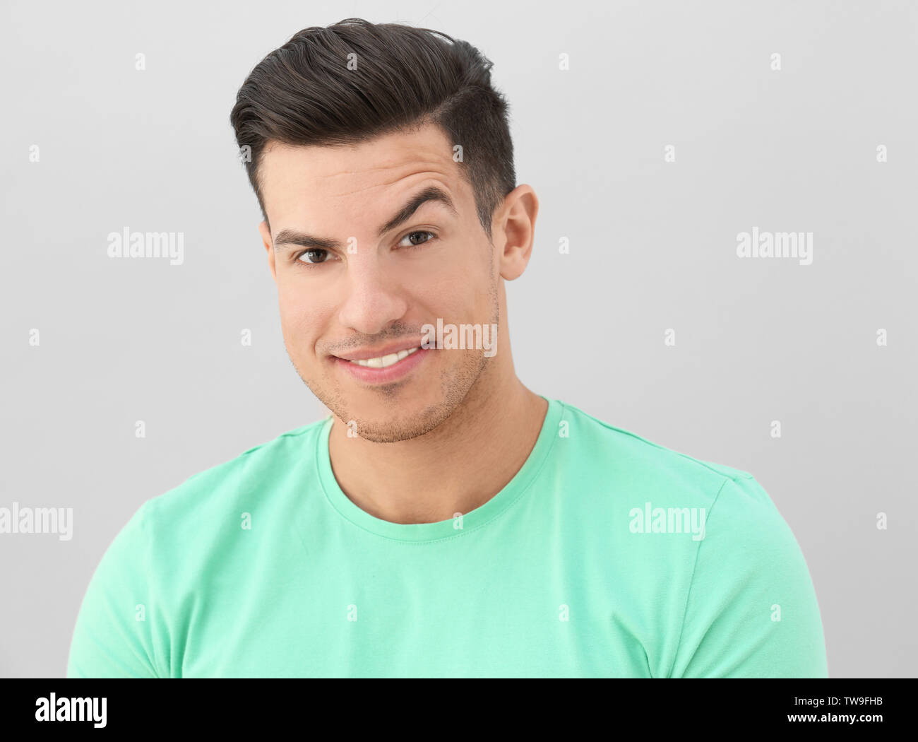Young man raised eyebrow hi-res stock photography and images - Alamy
