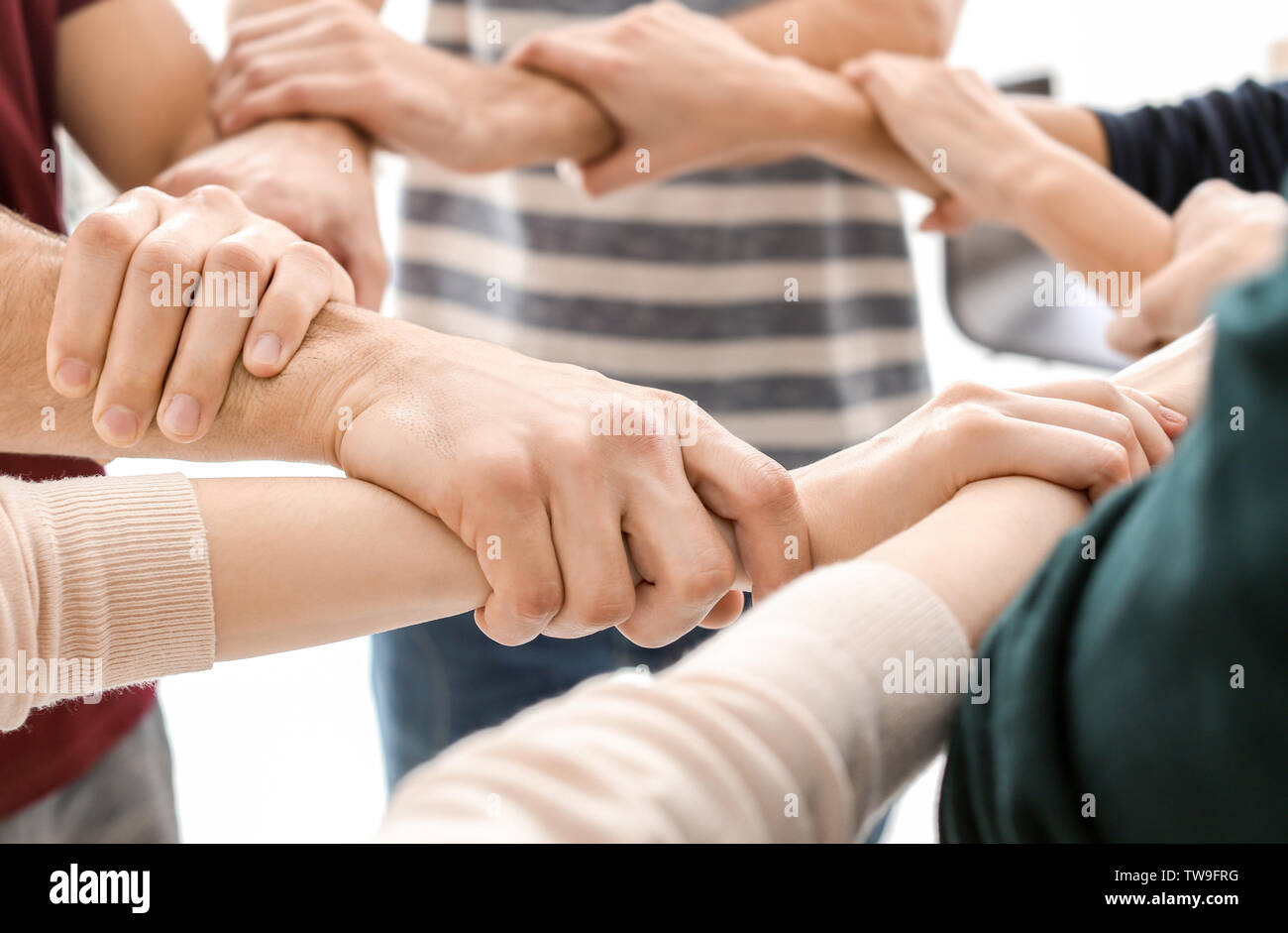 People holding hands together, closeup. Unity concept Stock Photo - Alamy