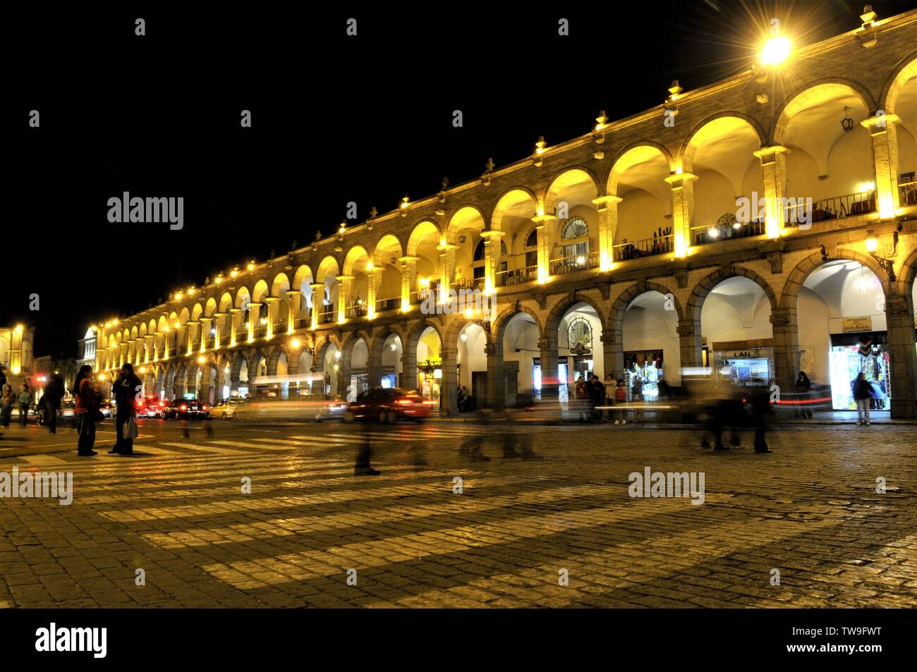 PERU, AREQUIPA, A NIGHT VIEW OF THE SPANISH COLONIAL ARCADES Stock ...