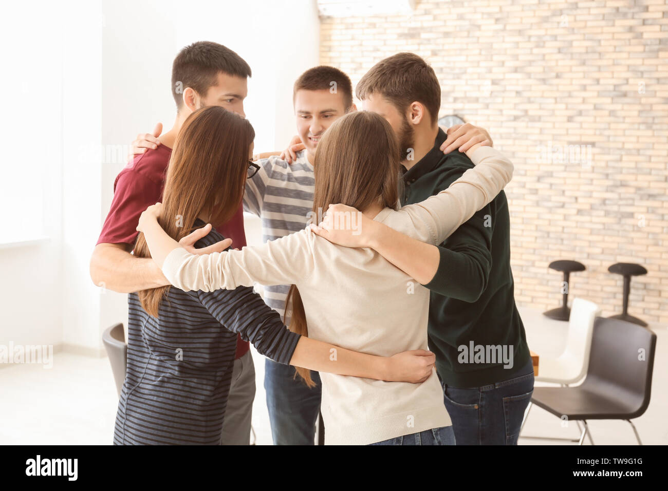 People standing together in circle, indoors. Unity concept Stock Photo ...
