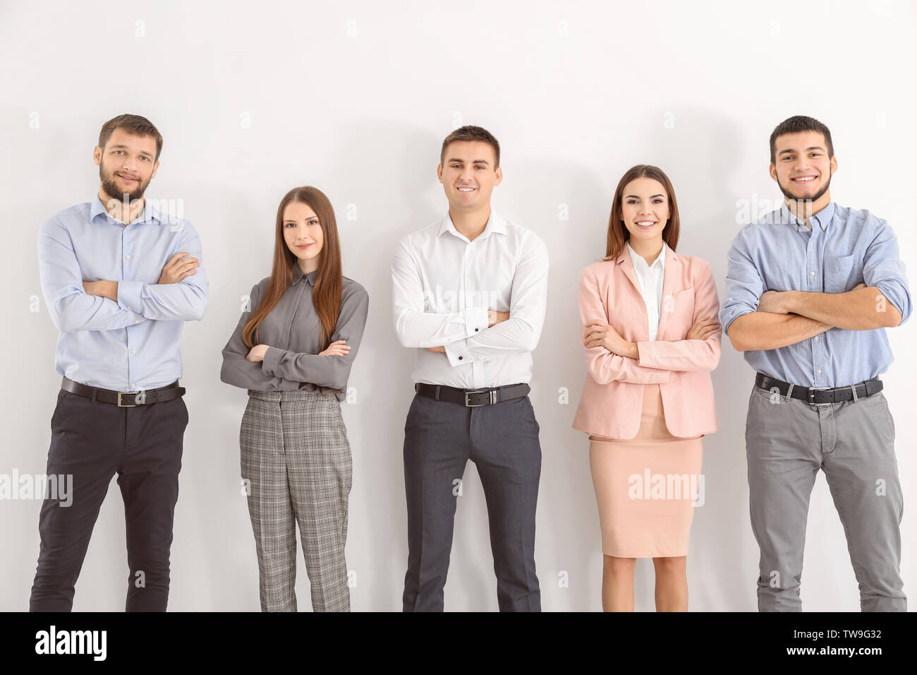 Young people against white wall. Unity concept Stock Photo - Alamy