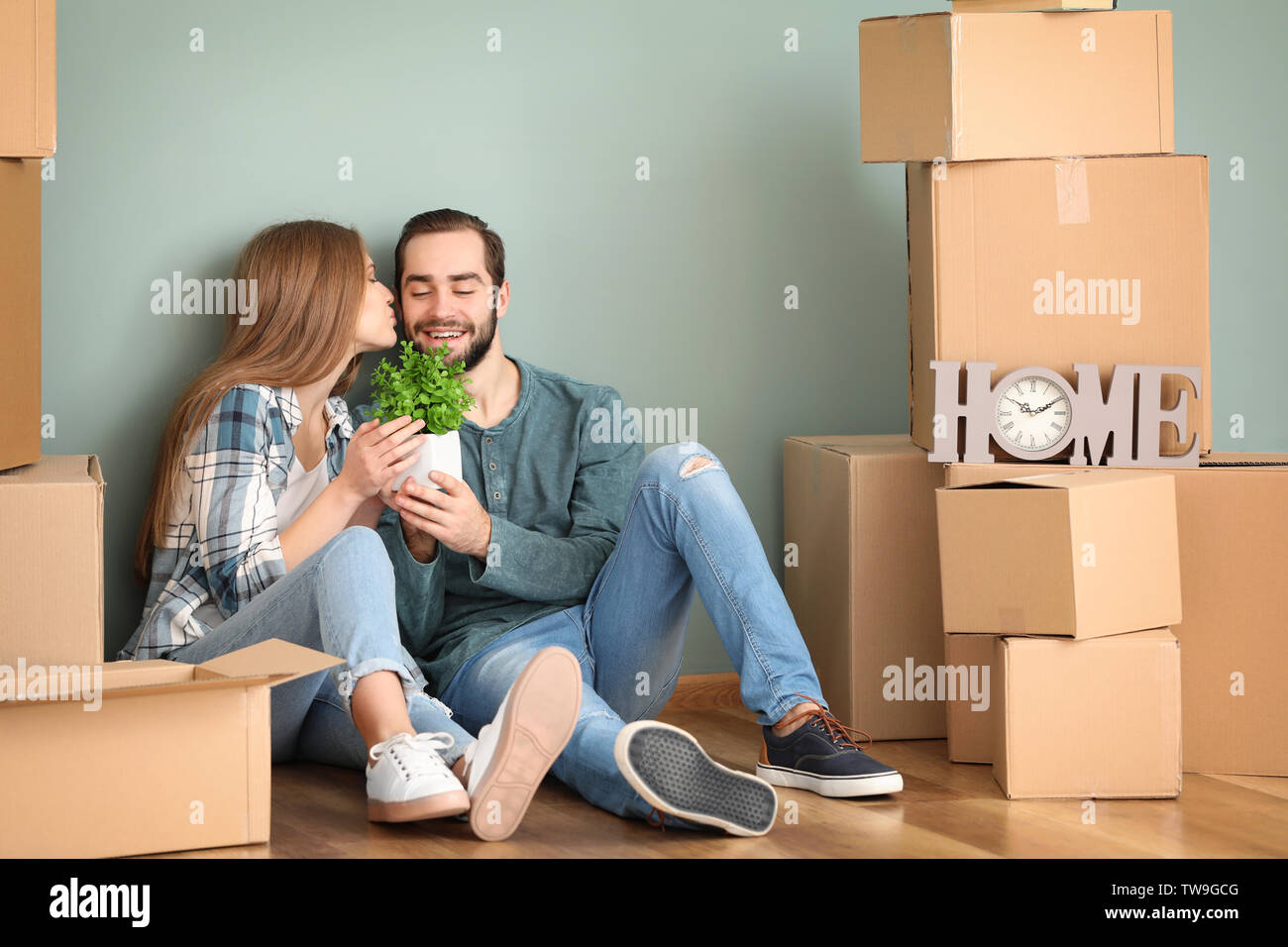 Young couple in their new house. Moving day Stock Photo - Alamy