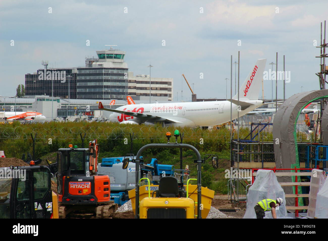 Families visiting Manchester airport's runway visitor park watching the ...