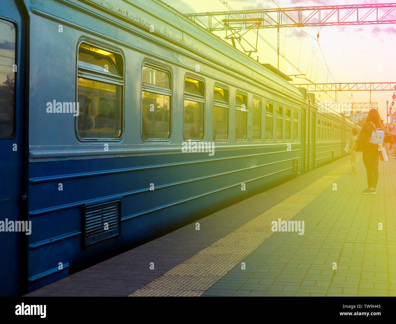 train stop at railway station with sunset Stock Photo - Alamy