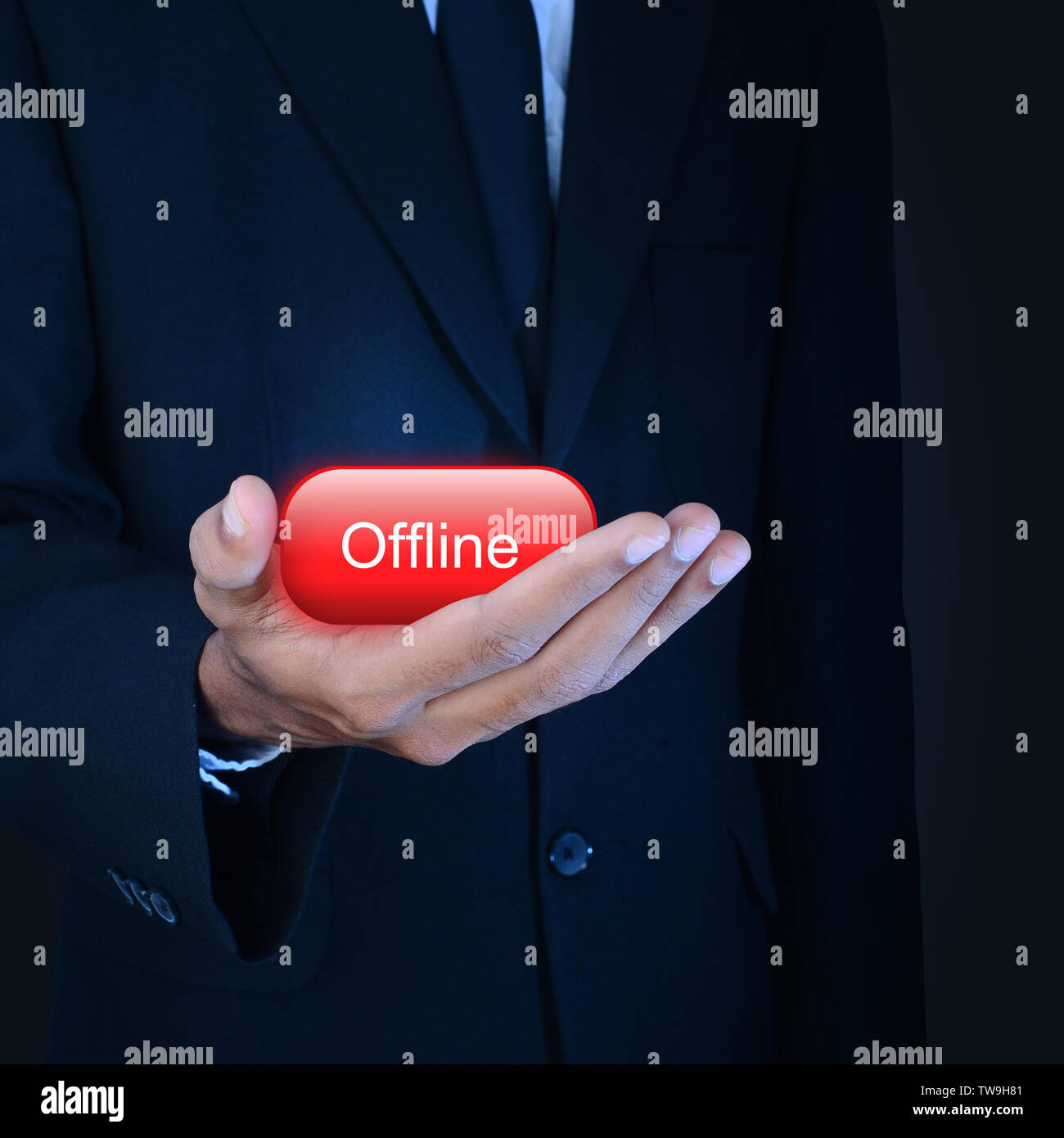 Business man with offline button Stock Photo - Alamy
