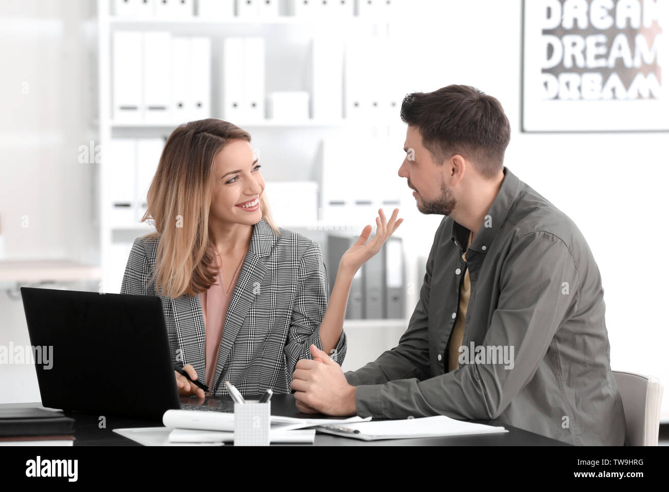 Consulting manager with man at meeting in office Stock Photo - Alamy