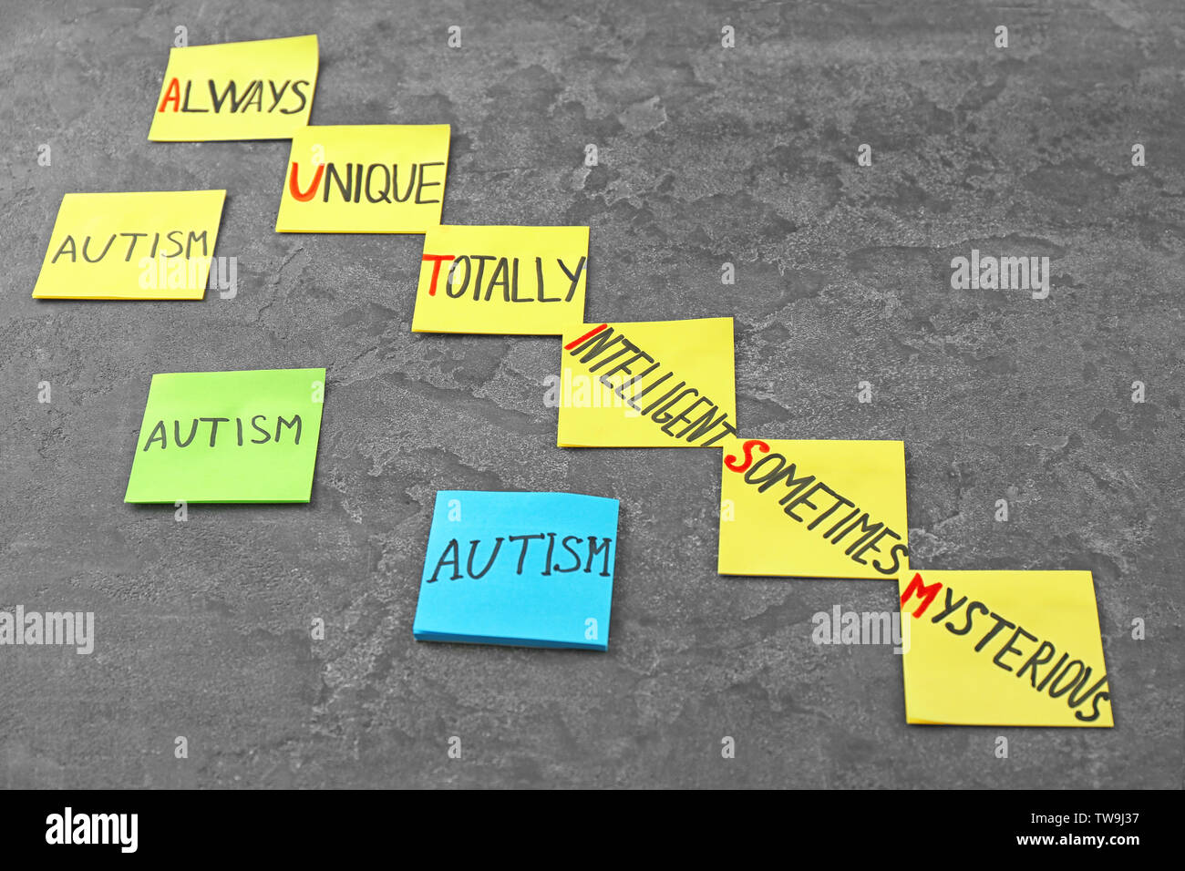 Stickers with abbreviation expansion for word "Autism" on grey ...