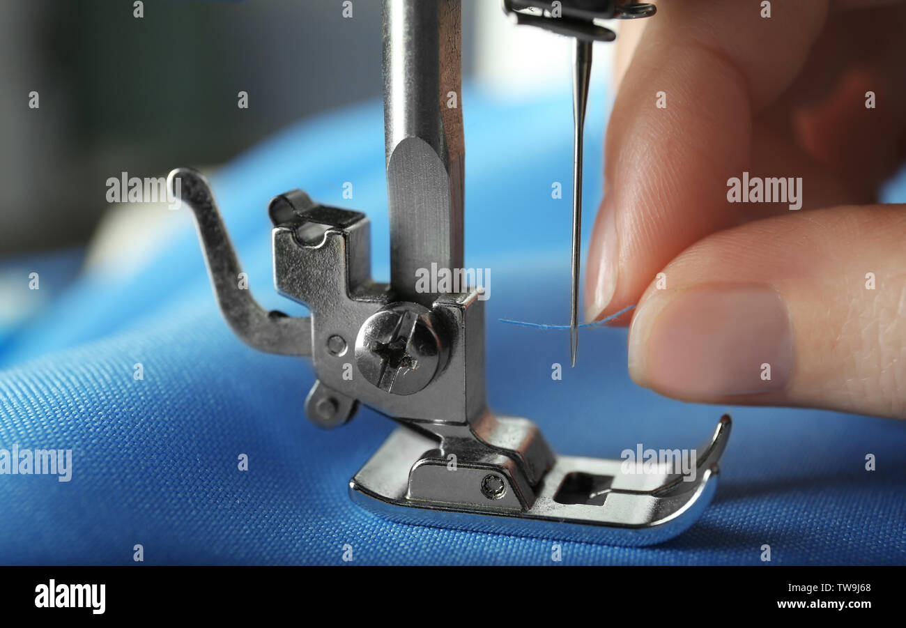 Woman threading hi-res stock photography and images - Alamy