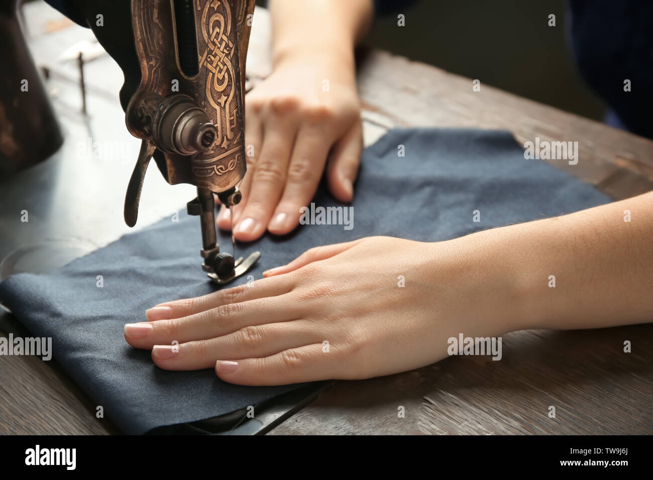 Person retro sewing machine hi-res stock photography and images - Alamy