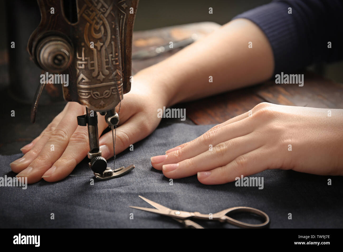 Person retro sewing machine hi-res stock photography and images - Alamy
