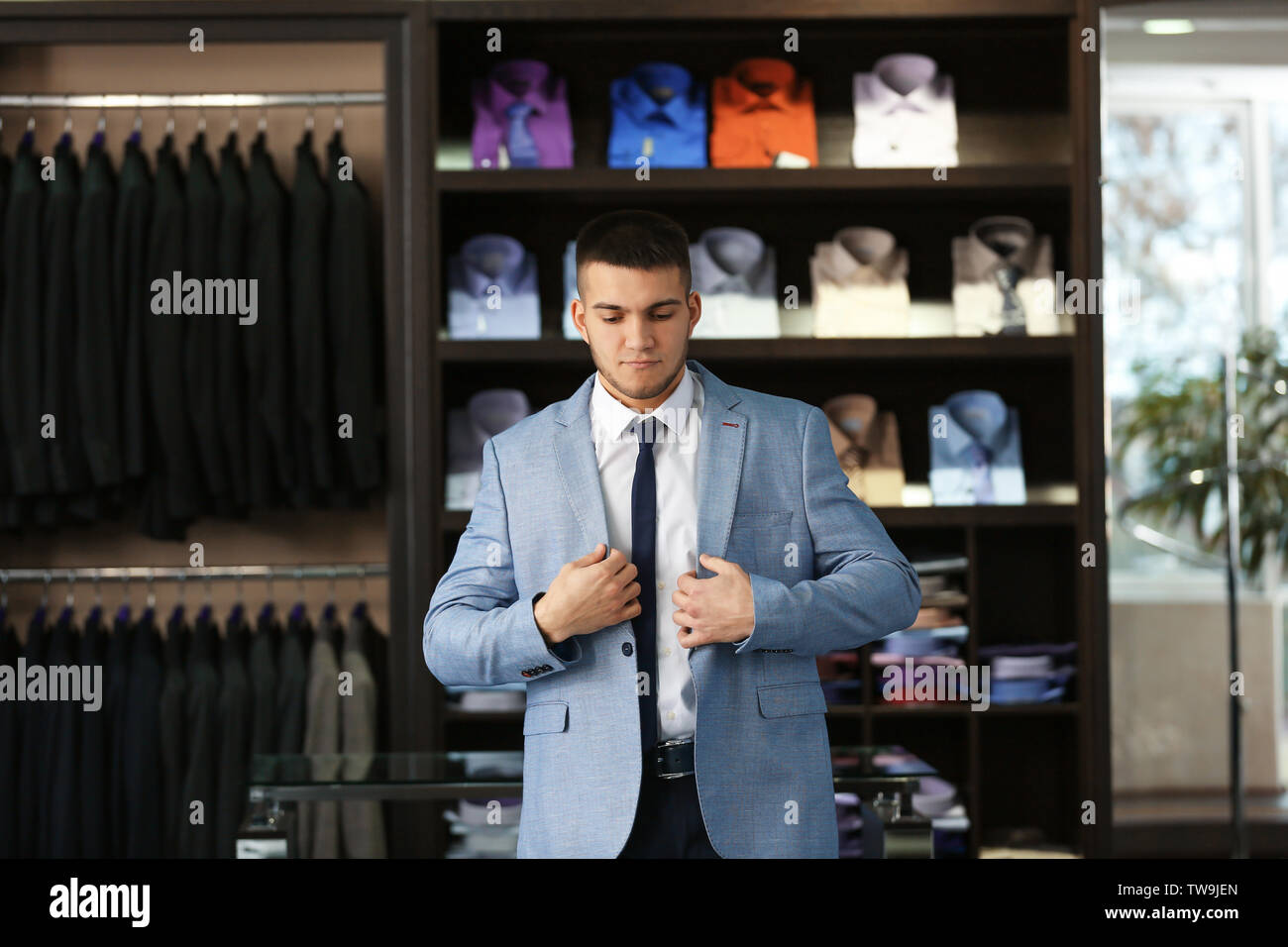 Trying on suit shop hi-res stock photography and images - Alamy