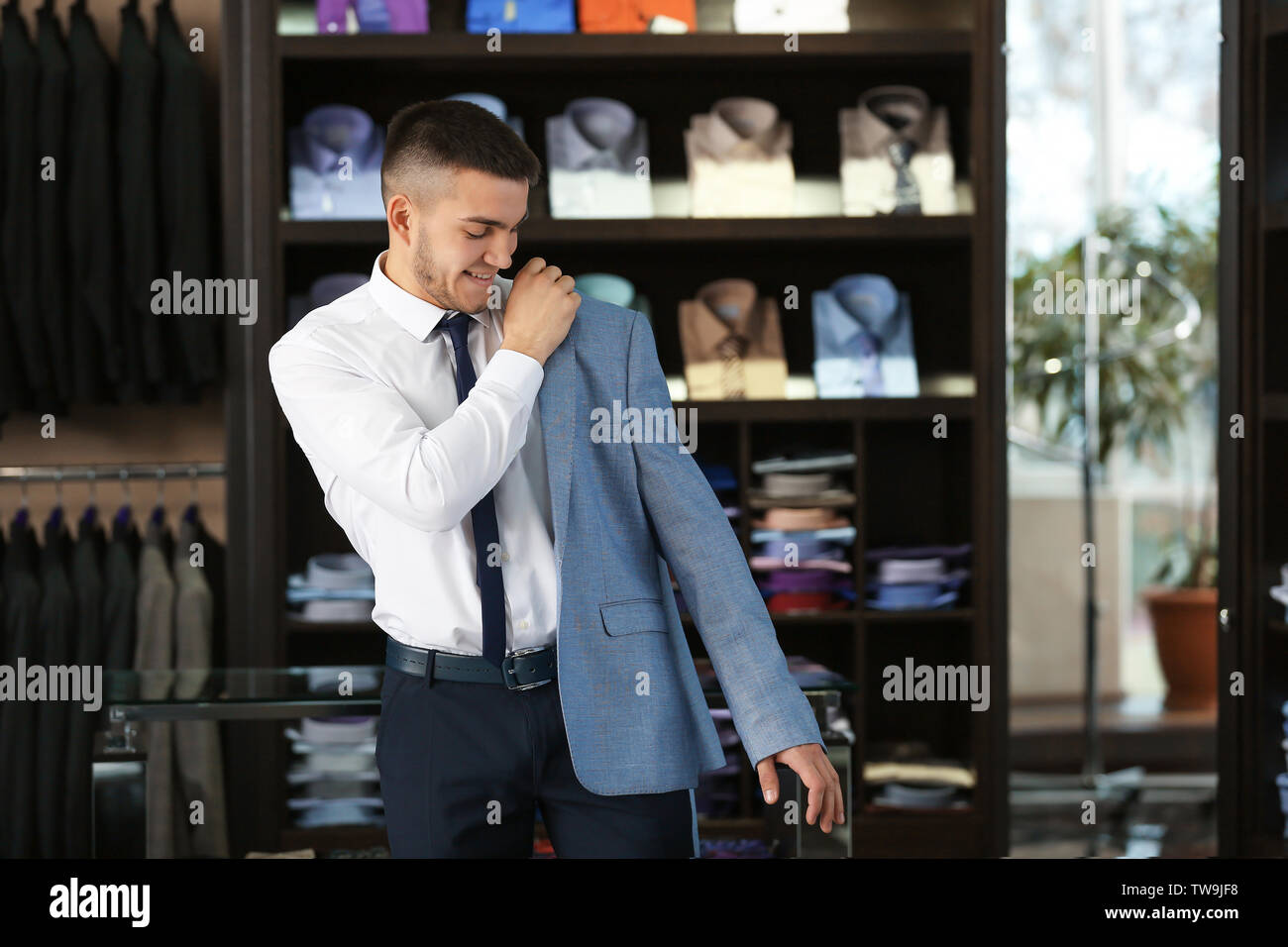 Trying on suit shop hi-res stock photography and images - Alamy
