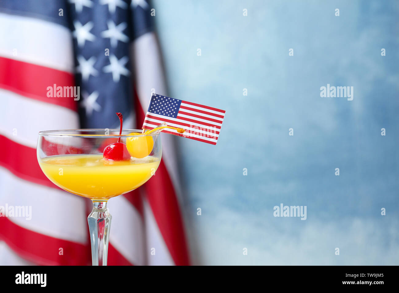 Glass with alcoholic cocktail on American flag background Stock Photo ...