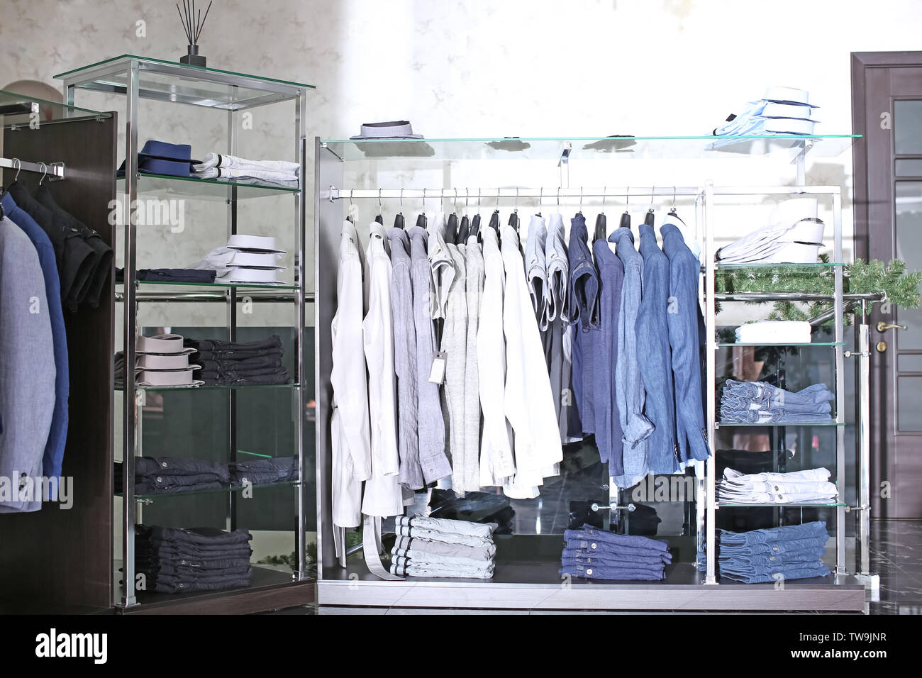 Rack with men's clothes in boutique Stock Photo - Alamy