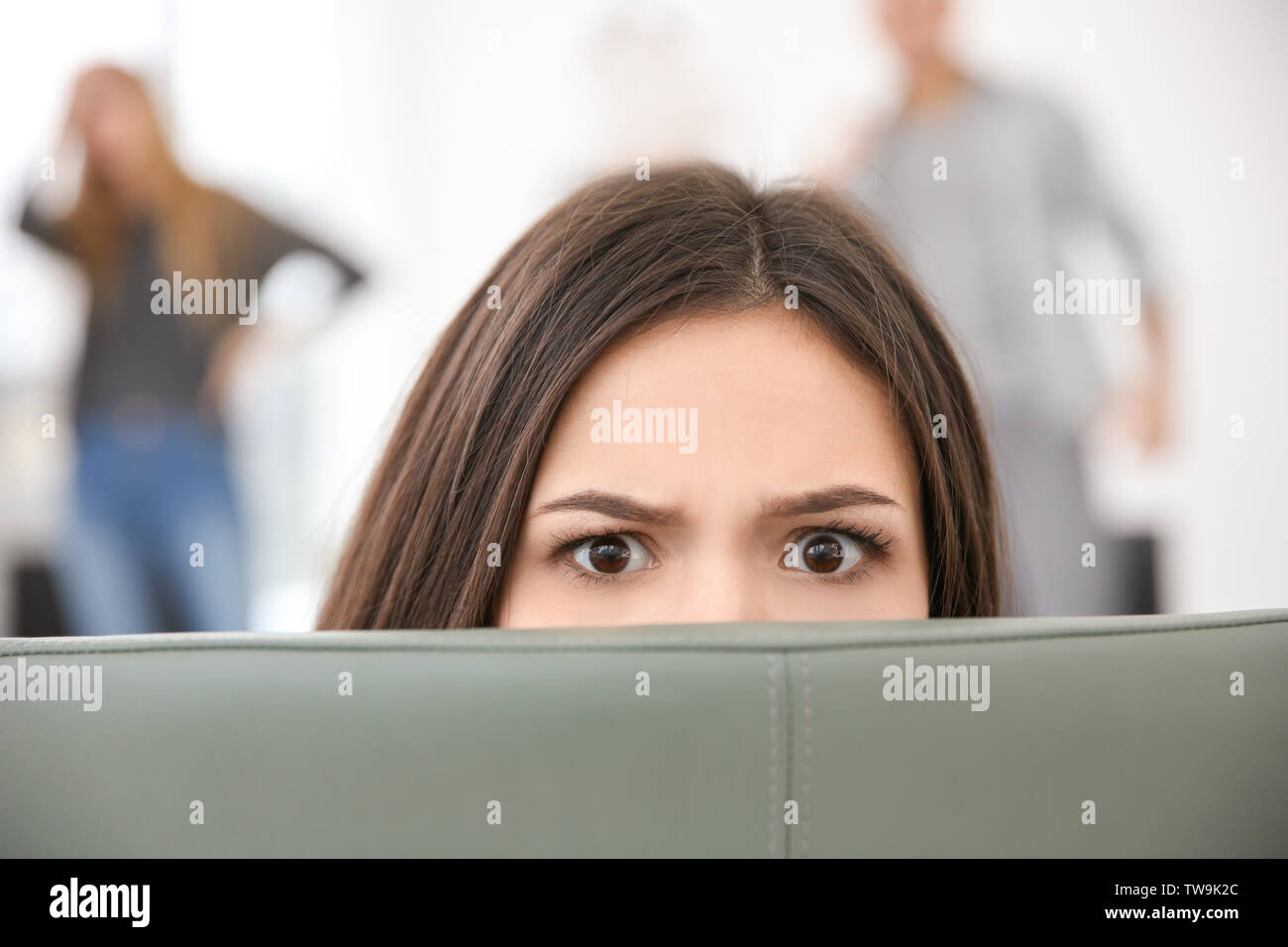 Hiding behind chair hi-res stock photography and images - Alamy