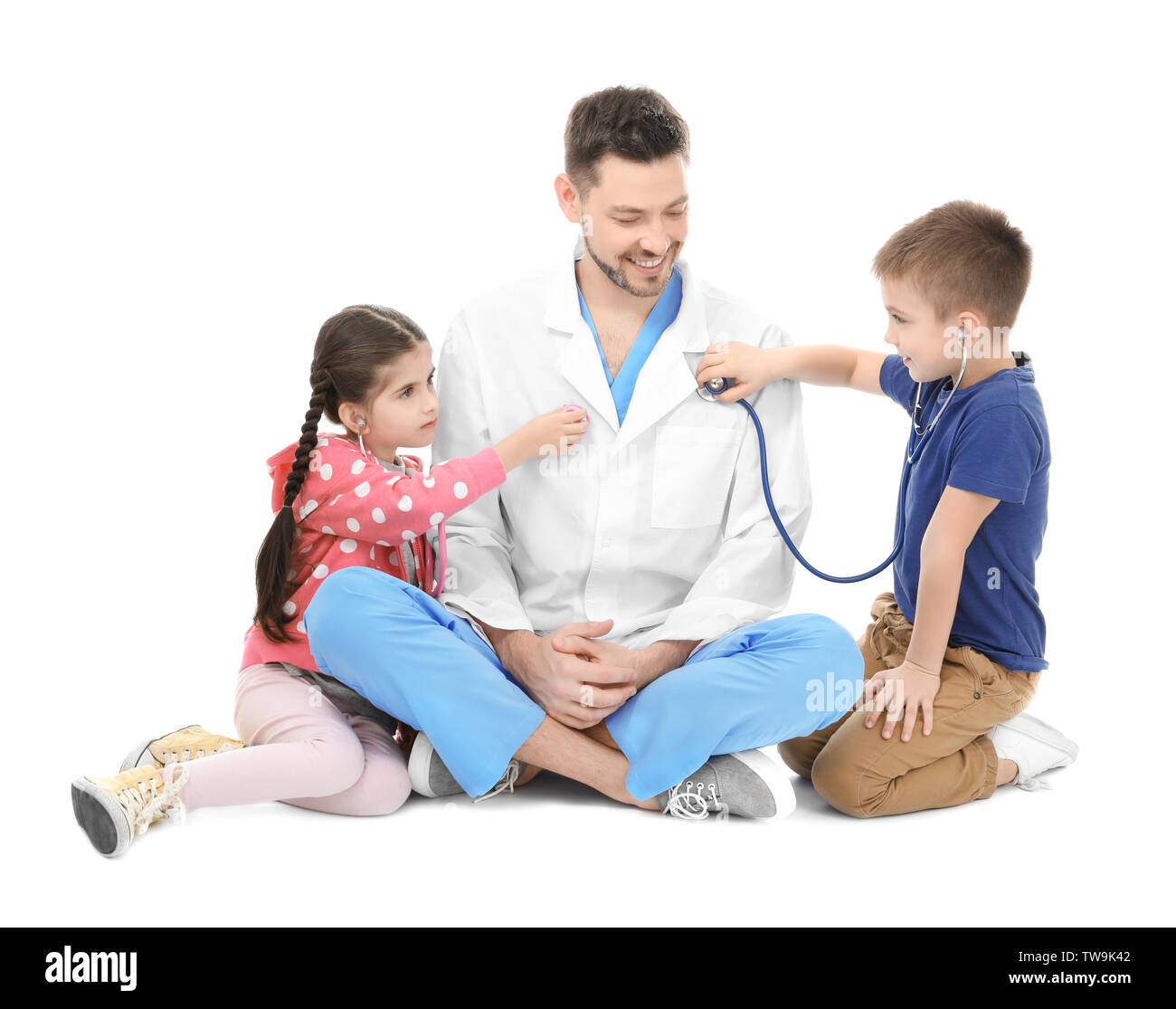 Children's doctor with little kids on white background Stock Photo - Alamy