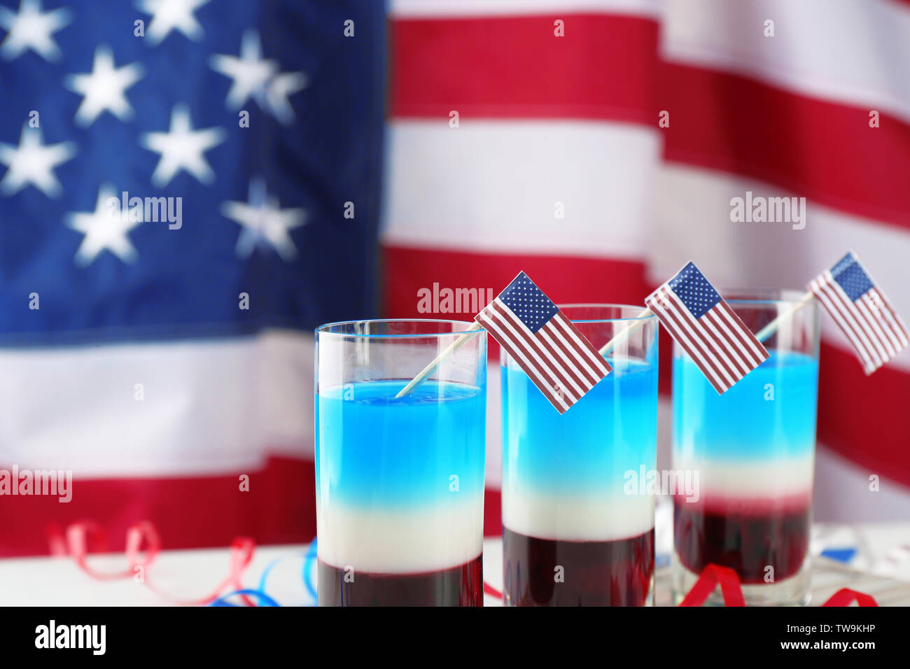 Layered cocktails in colors of American flag on table Stock Photo - Alamy