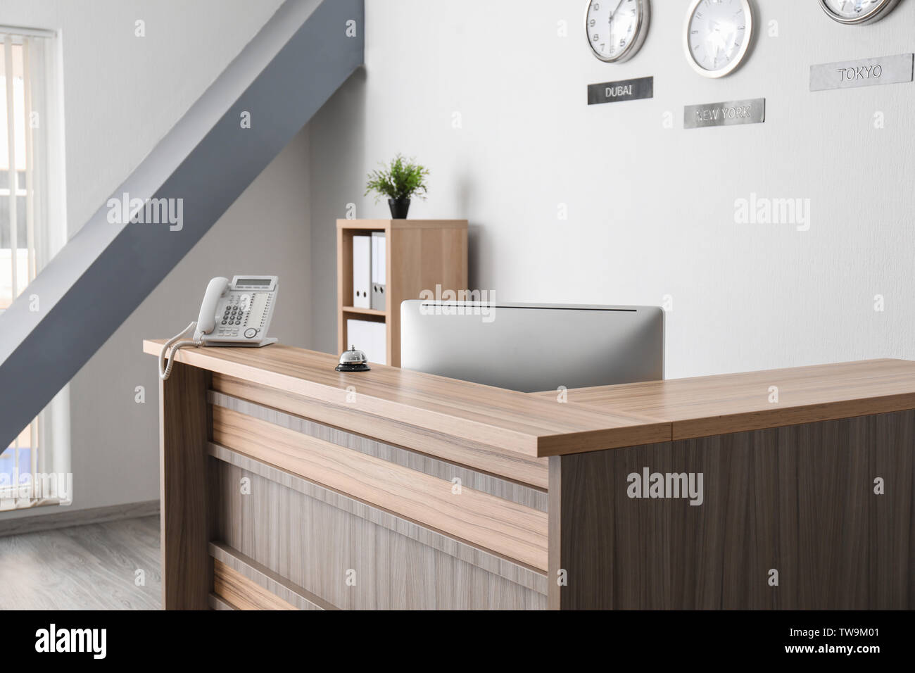 Reception desk in hotel Stock Photo - Alamy