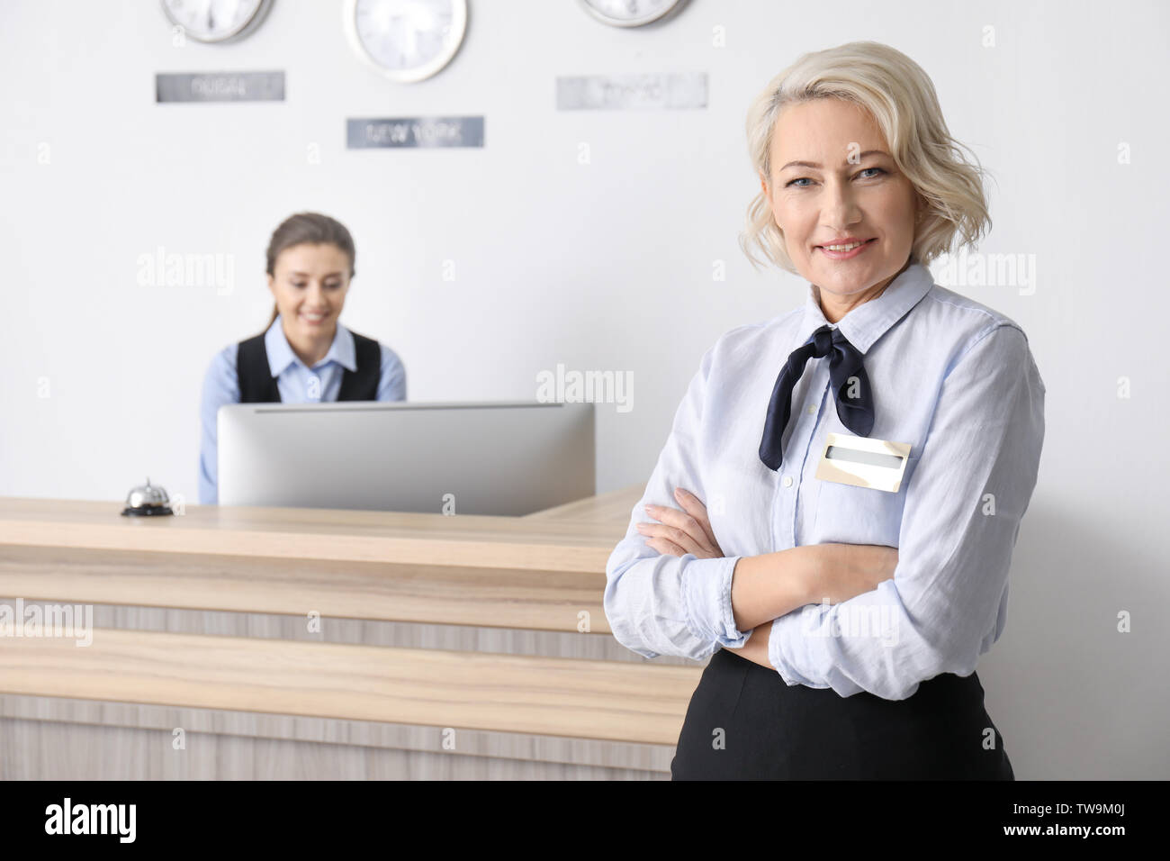 Female hotel receptionist at workplace Stock Photo - Alamy