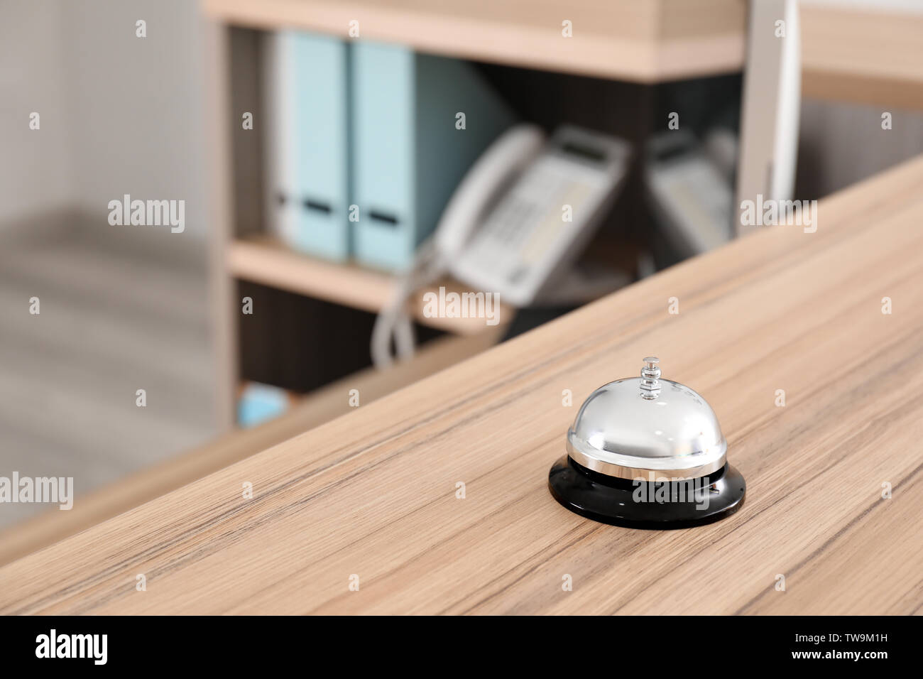 Service bell on reception desk in hotel Stock Photo - Alamy