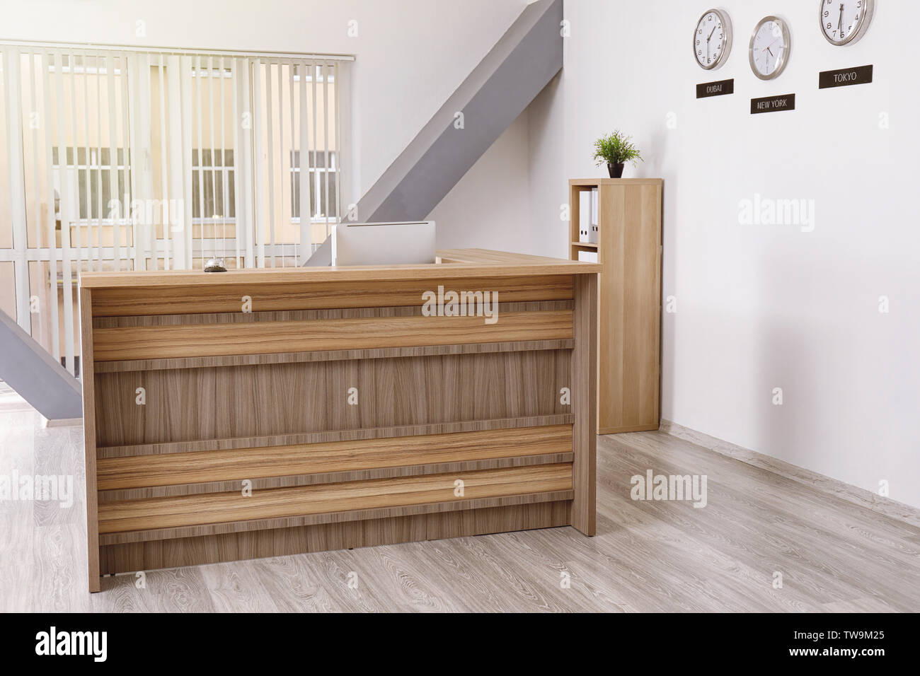 Reception desk in hotel Stock Photo - Alamy