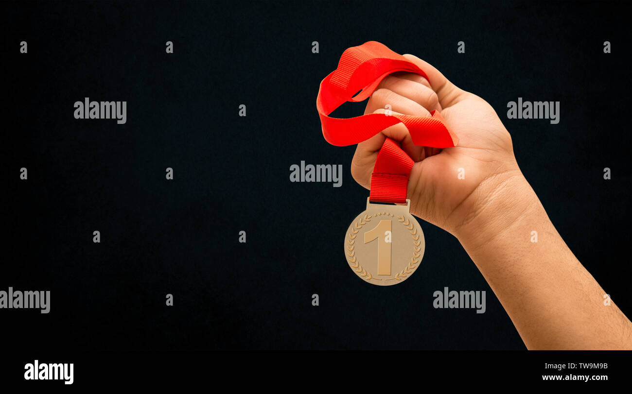 1st position award Ribbon in hand, banner on black background, Success ...