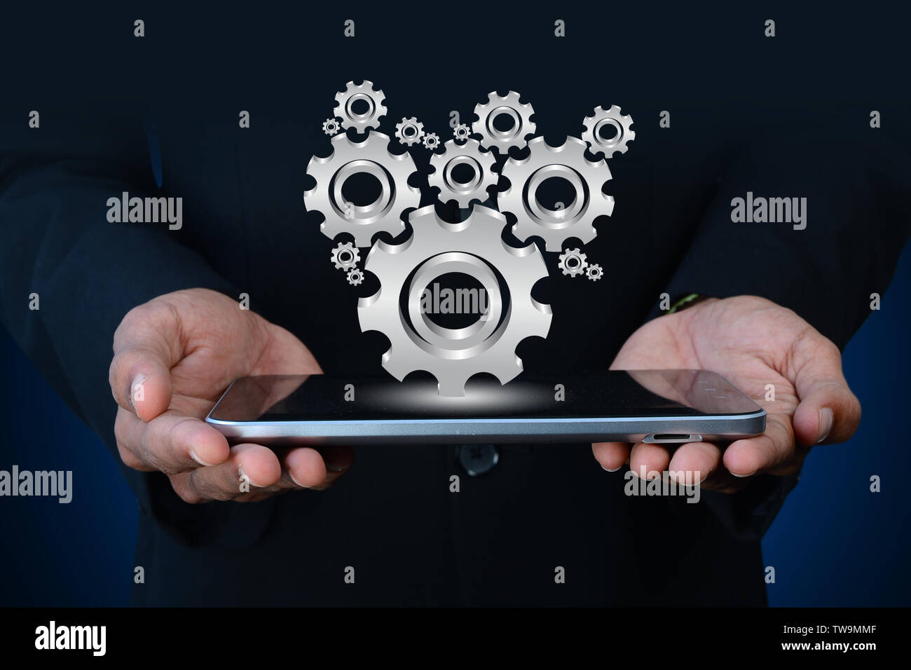 businessman showing gears cogs to success concept Stock Photo - Alamy