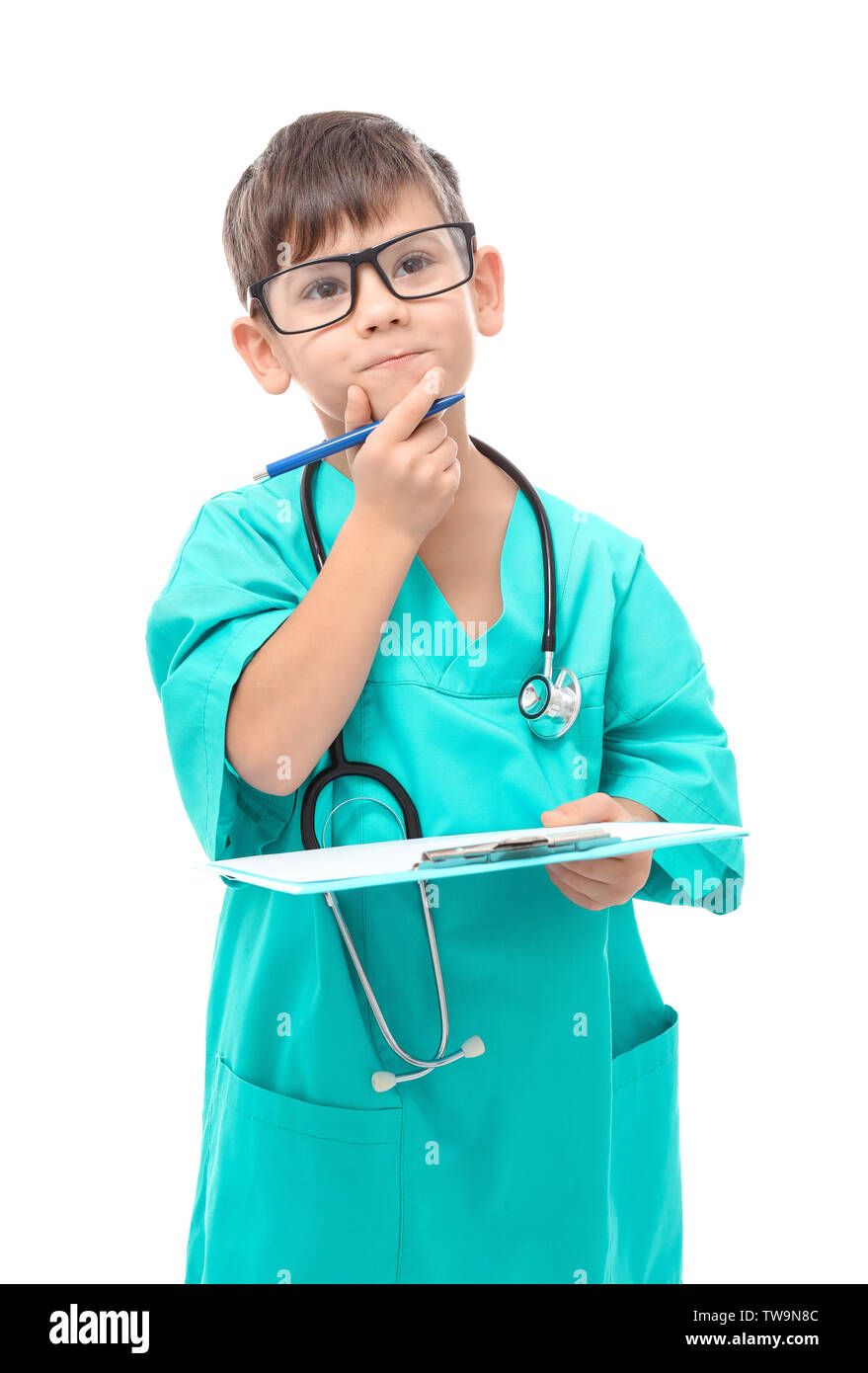 Cute little boy in doctor uniform with clipboard on white background ...