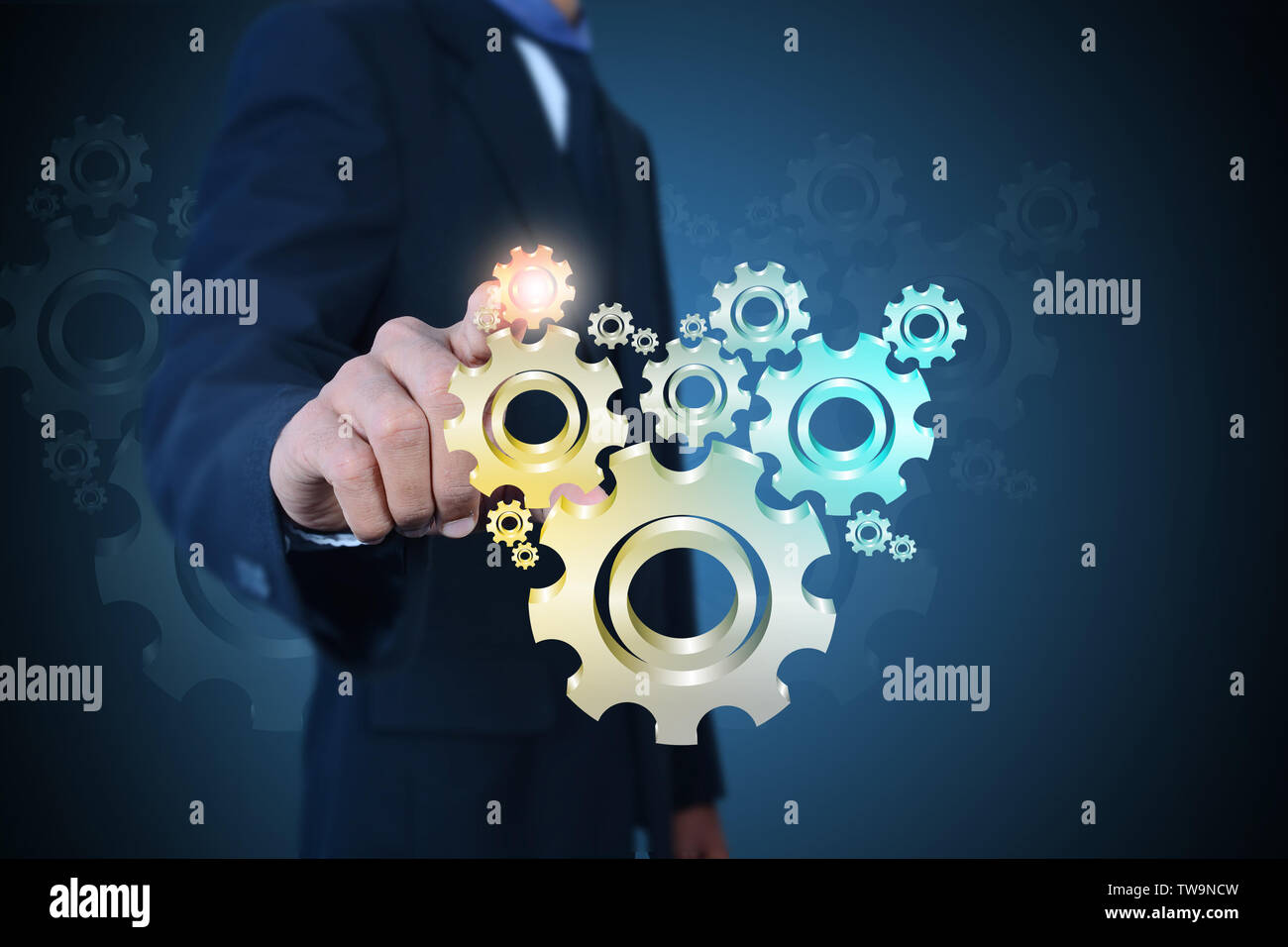 businessman showing gears cogs to success concept Stock Photo - Alamy