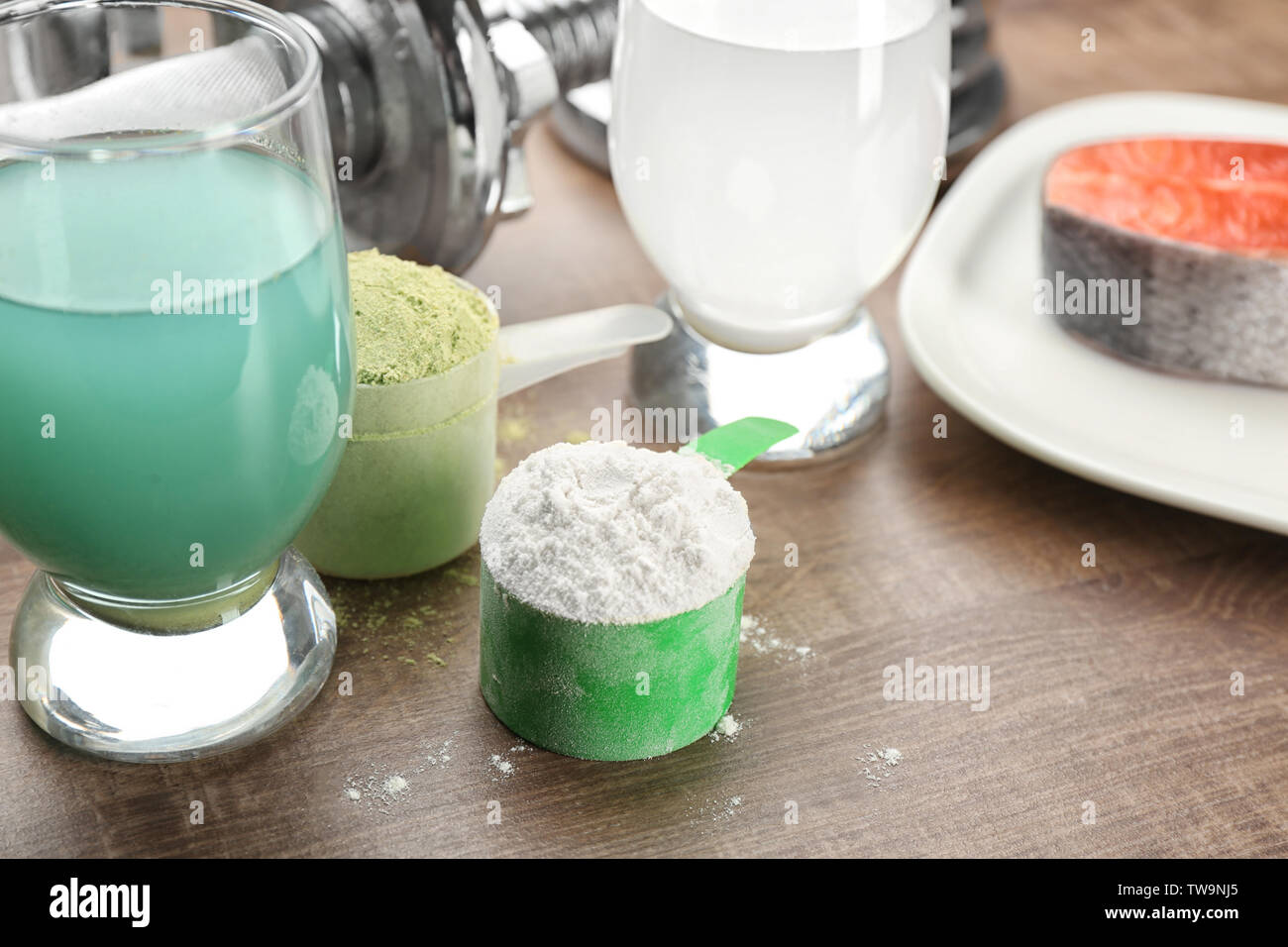 Different protein shakes and powders on table Stock Photo - Alamy