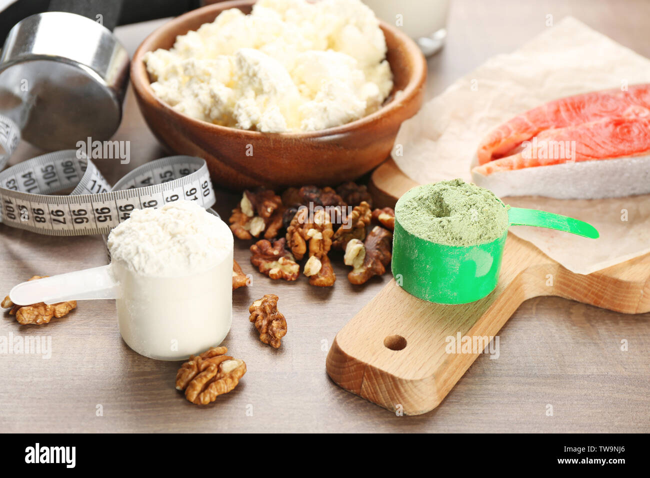 High protein food and different powders on table Stock Photo - Alamy