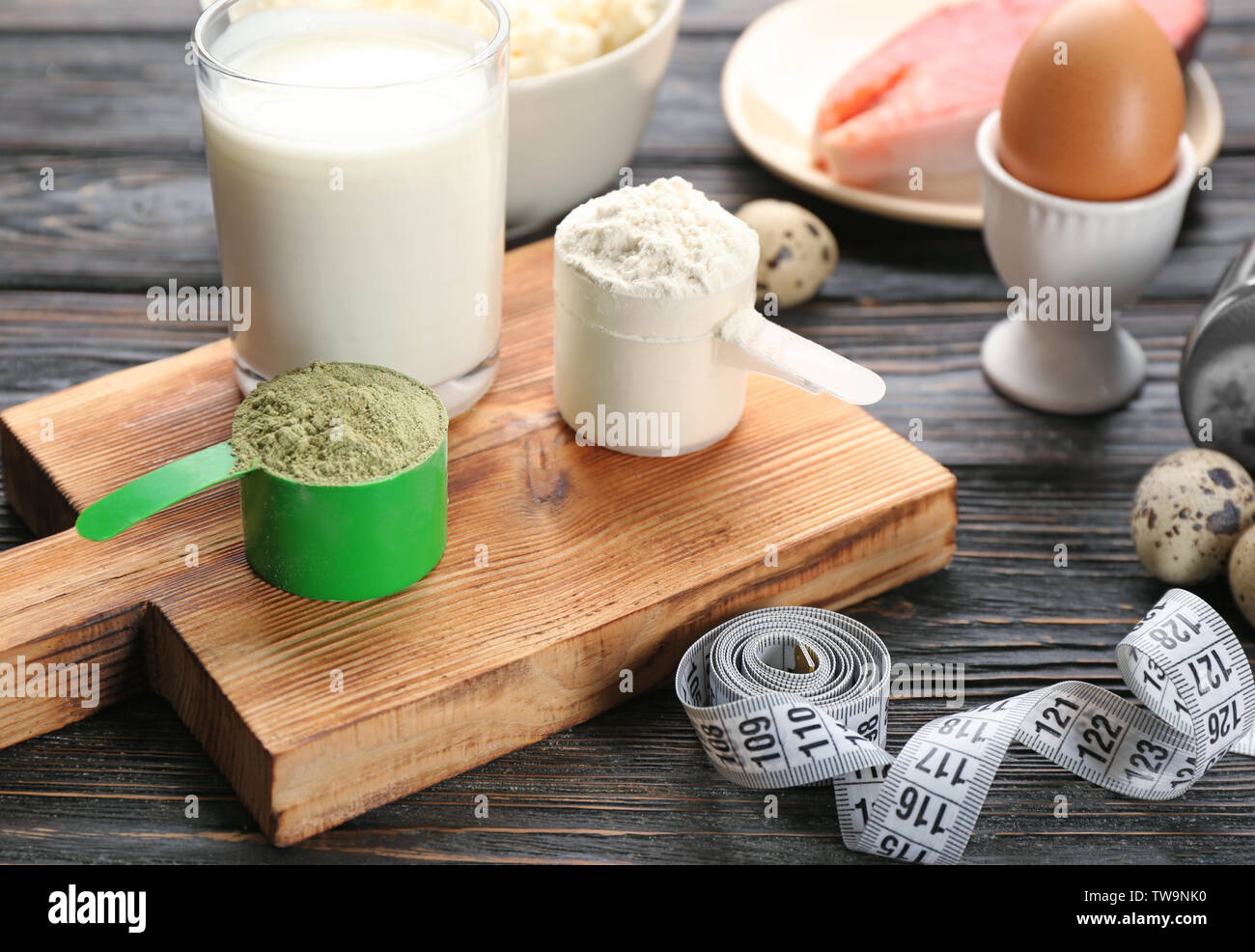 High protein food and different powders on table Stock Photo - Alamy
