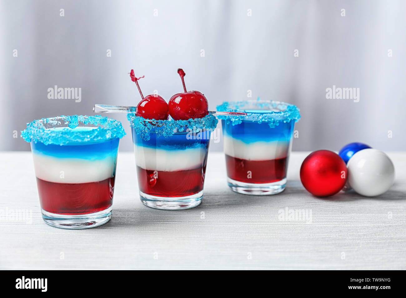 Layered cocktails in colors of American flag on table Stock Photo - Alamy
