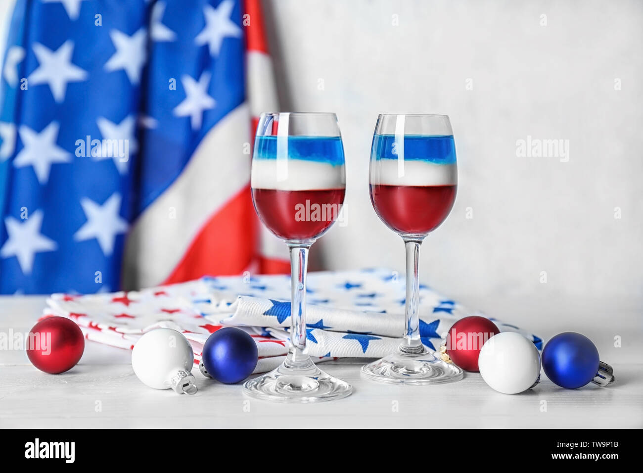 Layered cocktails in colors of American flag on table Stock Photo - Alamy