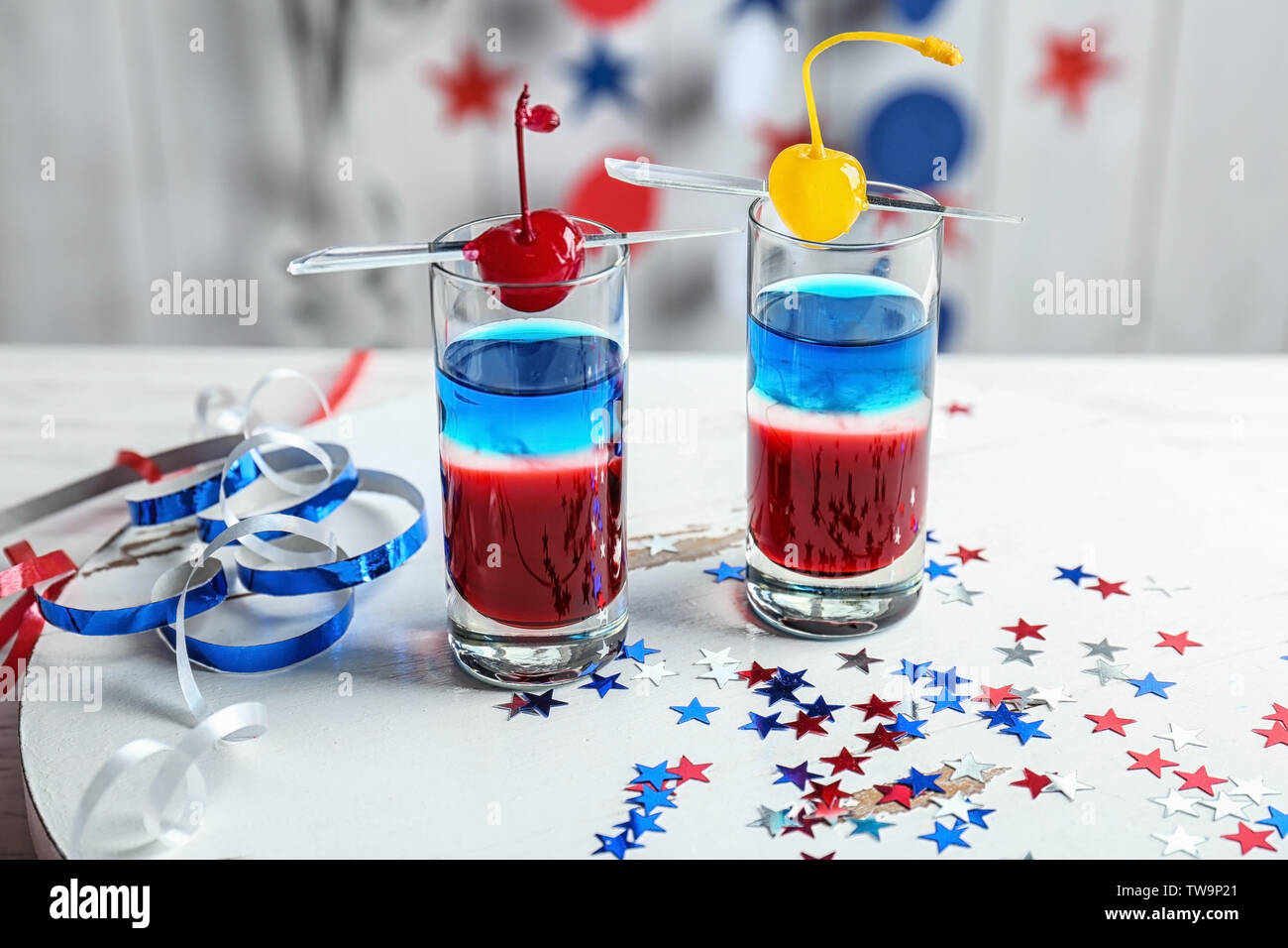 Layered cocktails in colors of American flag on table Stock Photo - Alamy