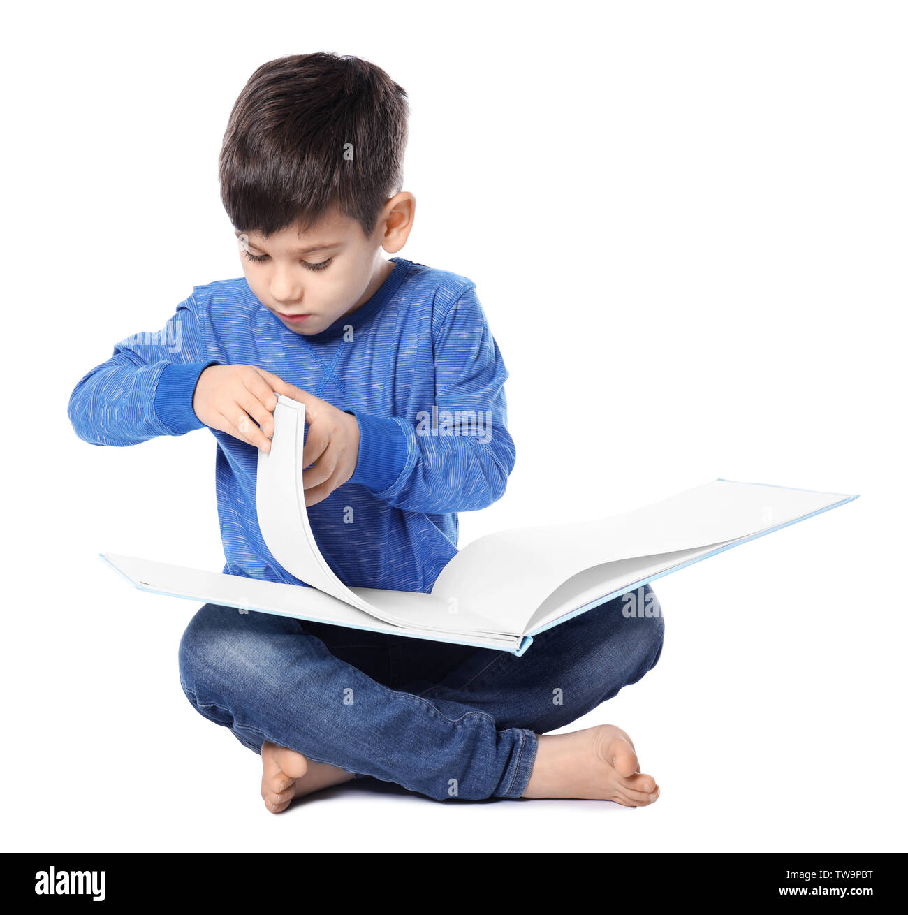 Cute little boy reading book on white background Stock Photo - Alamy