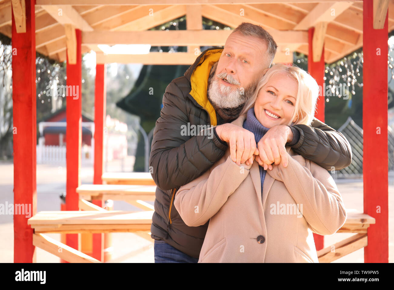 Happy mature couple hugging outdoors Stock Photo - Alamy