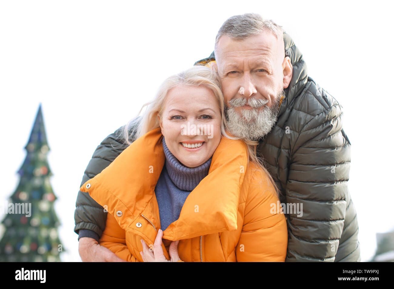 Retired woman hugging tree hi-res stock photography and images - Alamy