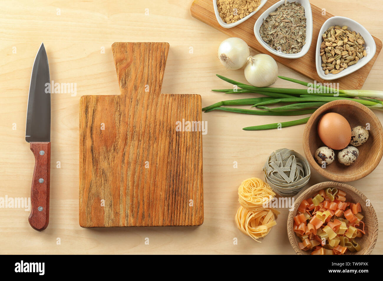 Wooden board and products on light background. Cooking master classes ...