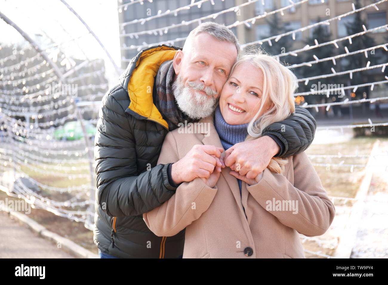 Happy mature couple hugging outdoors Stock Photo - Alamy