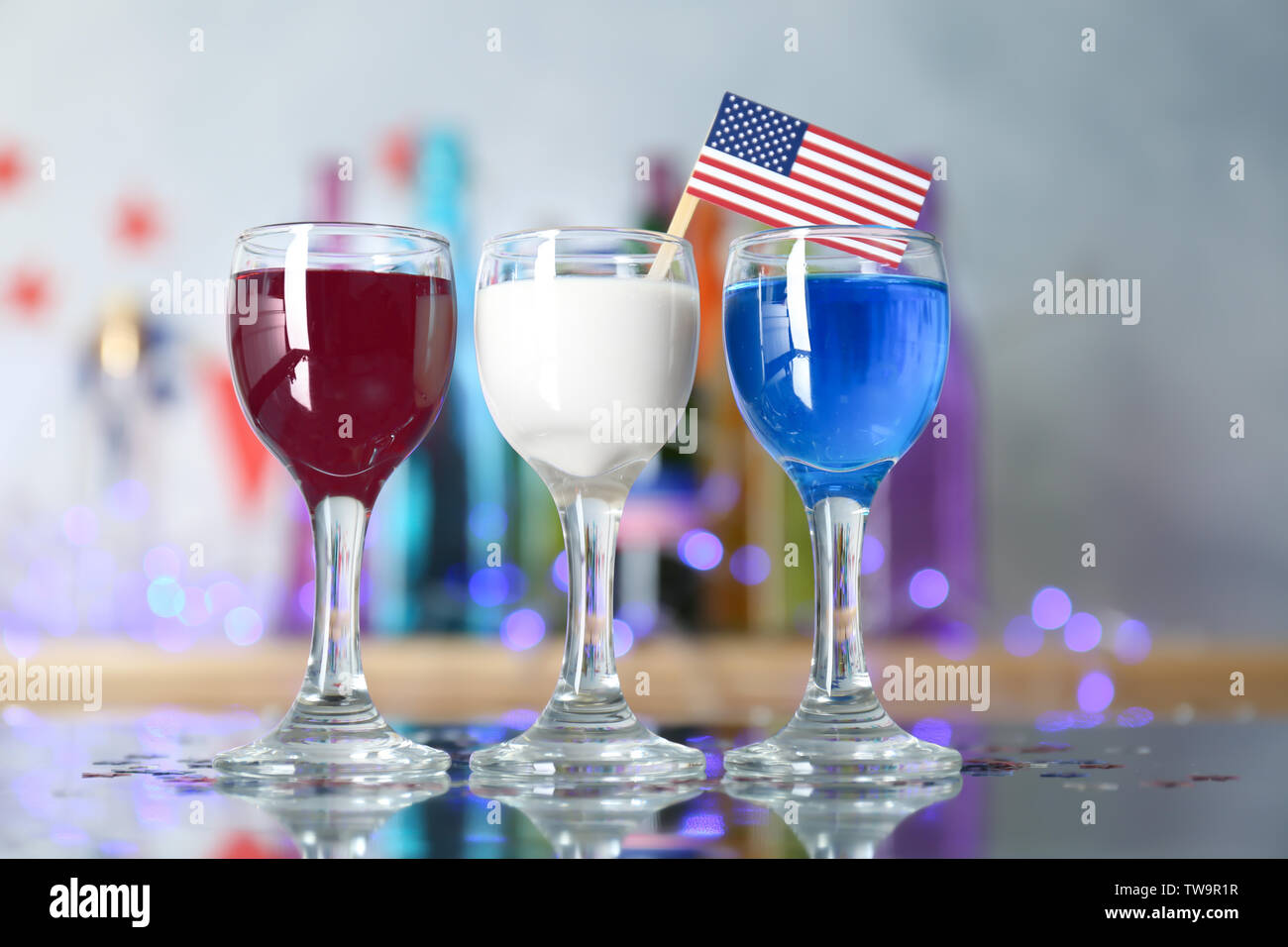 Cocktails in colors of American flag on table Stock Photo - Alamy