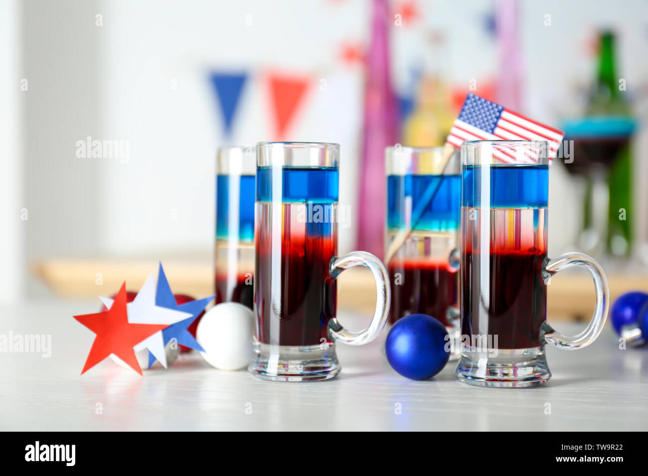 Layered cocktails in colors of American flag on table Stock Photo - Alamy