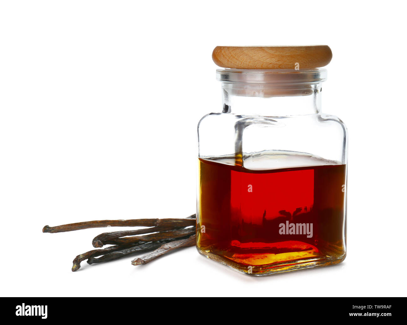 Jar with vanilla extract and sticks on white background Stock Photo - Alamy