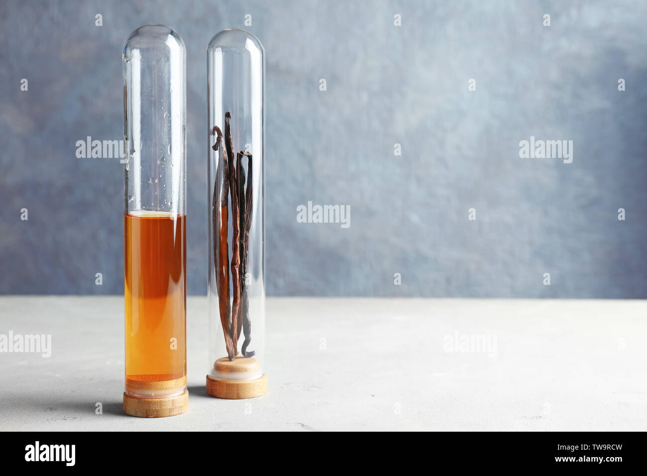 Vials with vanilla extract and sticks on table Stock Photo - Alamy